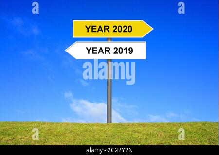 Signpost outside is showing This Year and Next Year Stock Photo - Alamy