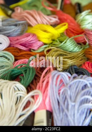 Threads and colorful materials to make bracelets Stock Photo - Alamy