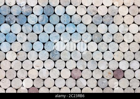 Pile of concrete cylinder bricks. Storage of cylindrical cement samples ...