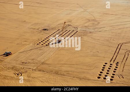 Ground compactors at work at the first stage of building foundations ...
