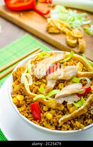 Chicken curry rice with crispy chinese omellete, chinese chopsticks ...