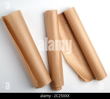 ripped textured white paper with rolled edge on blue background Stock ...