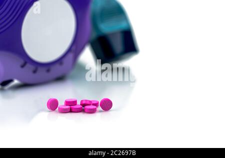 Asthma inhalers and tablets on white background Stock Photo - Alamy