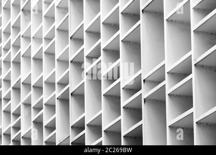 Closeup ventilated facade of concrete building. White ventilation with ...