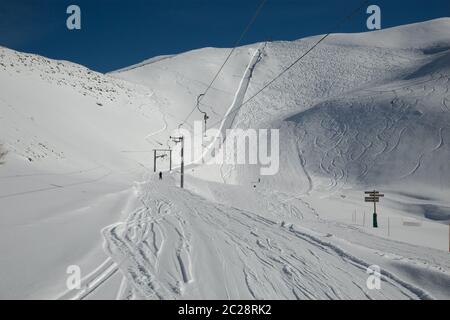Using ski lift to get to the top of ski slopes Stock Photo - Alamy