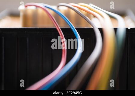 Colored power cables that come from a transformer Stock Photo - Alamy