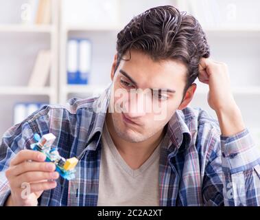 Computer technician repairing broken computer in workshop Stock Photo ...