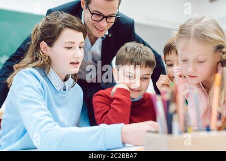 Team session in school class with all students working together as a ...