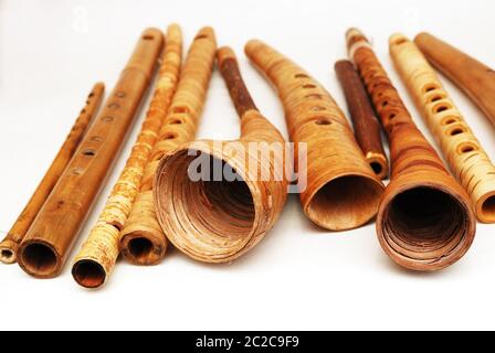 ancient woodwind folk instruments on a white Stock Photo - Alamy
