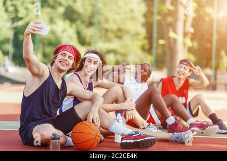 Basketball players taking a selfie Stock Photo - Alamy