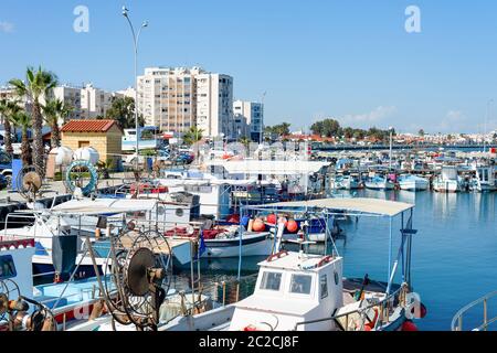 Marina with yachts and cityscape of Larnaca with waterfront apartments ...