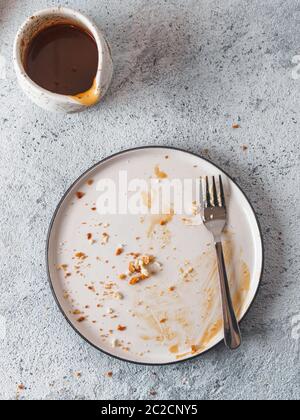 Top view of empty dirty plate on a table Stock Photo - Alamy