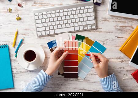 Web designer choosing colors from swatches Stock Photo - Alamy