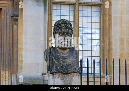 One of 17 different carved heads outside the Sheldonian Theatre and ...
