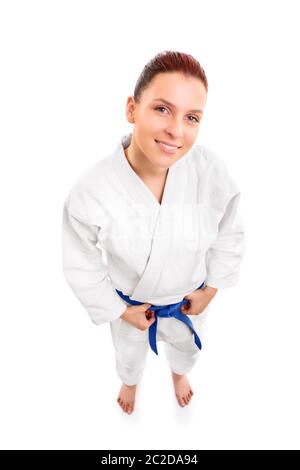 A portrait of a beautiful young female aikido fighter smiling, from top ...