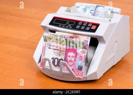 Scottish Pounds in a counting machine Stock Photo - Alamy