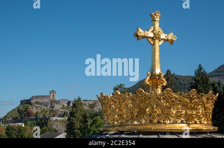 The gilded crown ad cross in Lourdes, France Stock Photo - Alamy