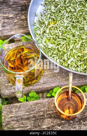 verbena tea on old wooden planks Stock Photo - Alamy