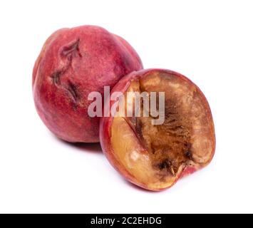 Group of rotten nectarines isolated on white background Stock Photo - Alamy
