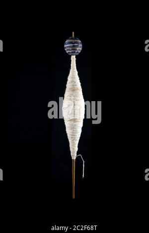 ancient hand spindle used for spinning coton and making yard on white ...