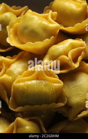 close up of raw italian pasta in plate on table Stock Photo - Alamy