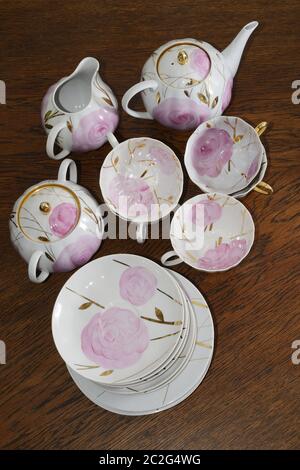 Luxury porcelain tea set on white tablecloth with white glaze bagels on ...