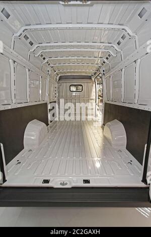 Empty long white delivery van transport Stock Photo - Alamy