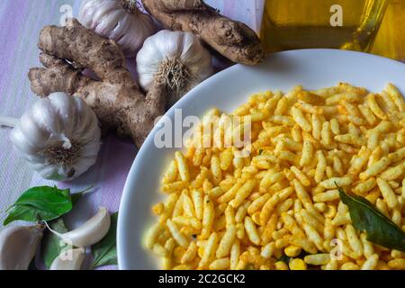 Spicy puffed rice (also known as muri, porri) along with spcied peanuts ...