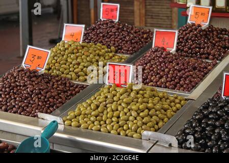 Bunch of various olives at market stall Stock Photo - Alamy