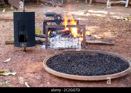 roasting coffee the old farm way, manual roaster, wood fire Stock Photo ...