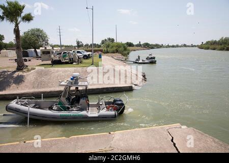 The U.S. Border Patrol works boats on the Rio Grande River south of ...