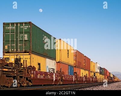 Double-stack intermodal railcars with containers and autoracks with ...