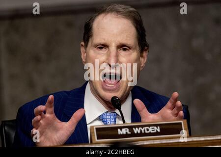 Sen. Ron Wyden (D-Ore.) speaks with a reporter at the U.S. Capitol July ...