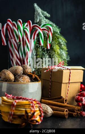 Christmas card concept with cinnamon sticks and holiday decor in dark ...