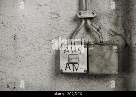 old light switch with the inscription "on, off" in an abandoned factory ...