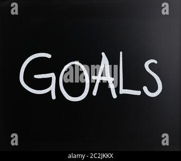 Goals handwritten with white chalk on a blackboard Stock Photo - Alamy