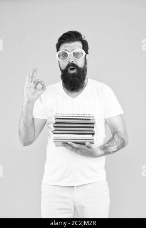 Geeky student reading a book Stock Photo - Alamy