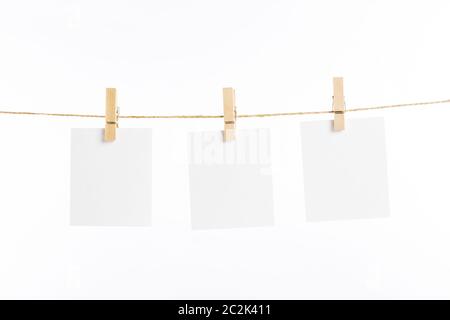 paper cards hanging rope isolated on white background Stock Photo - Alamy