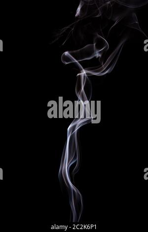 Abstract incense smoke isolated on black background Stock Photo - Alamy