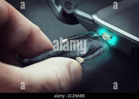 Man plugged into the laptop as a flash drive Stock Photo - Alamy
