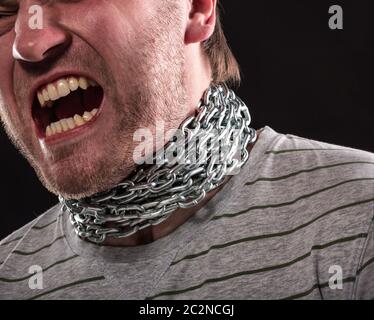 Screaming man with chain Stock Photo - Alamy