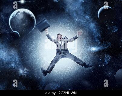 The frightened businessman in suit falling down and screaming against ...