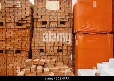 Hardware store assortment, packs of red bricks Stock Photo - Alamy