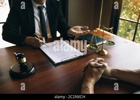Client is explaining the offense to the lawyer and working together to ...