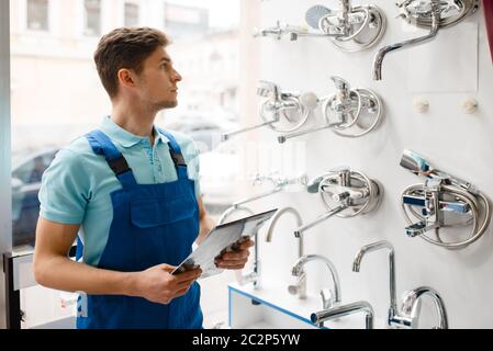 Showcase with plumbing taps and sanitary in the shop Stock Photo - Alamy