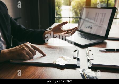 The bank clerk is talking to a customer who applied for a credit card ...