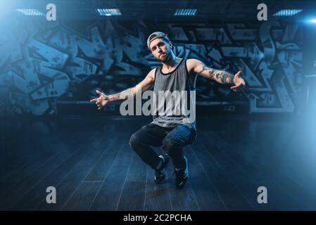 Male rapper in dance studio, trendy lifestyle. Modern urban dancing ...