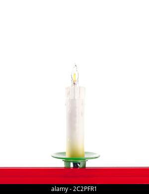 One Christmas candle. Isolated on white background Stock Photo - Alamy