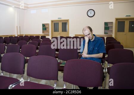 Boring lecture. Alone sleeping student in empty auditorium Stock Photo ...