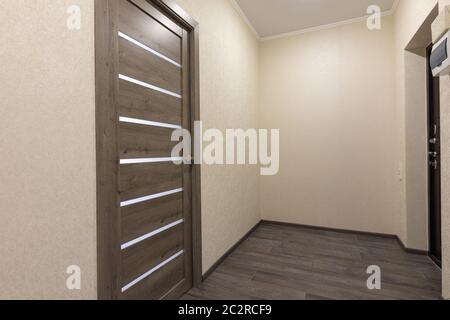 Empty corridor in the apartment at the front door Stock Photo - Alamy